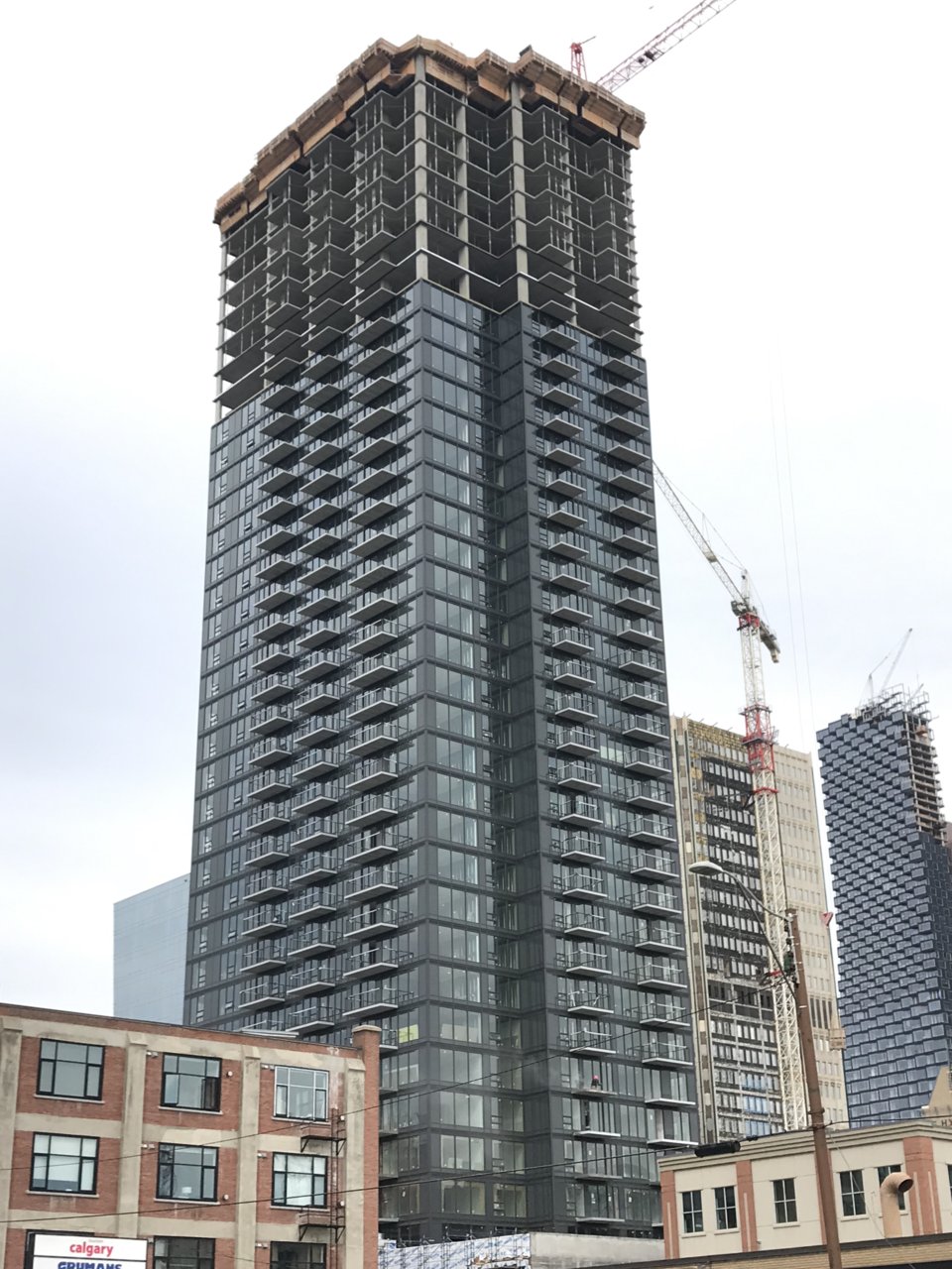 Cladding Continues as One Tower Reaches Final Height | SkyriseCalgary